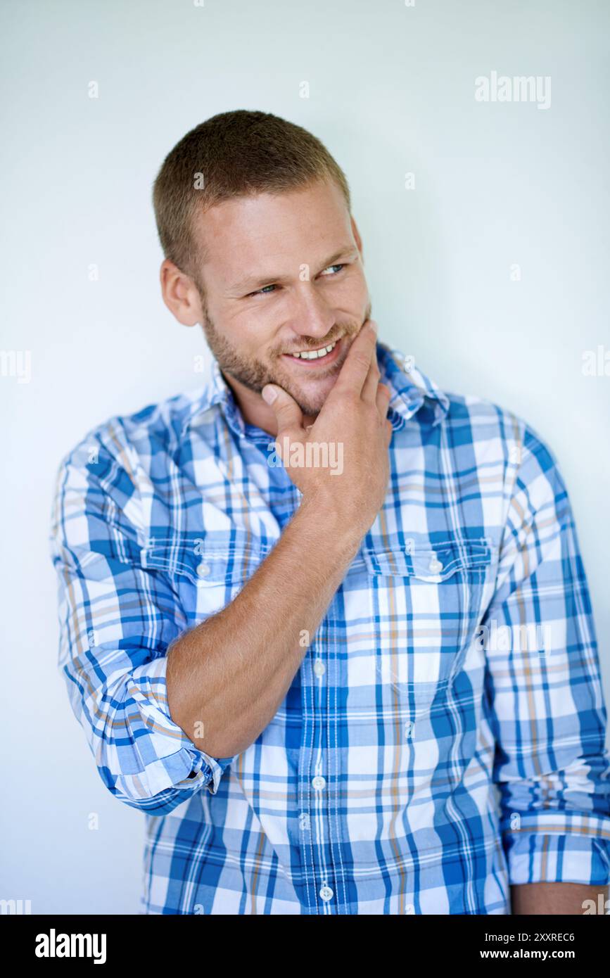Happy man, thinking and blue shirt with fashion for style or well ...