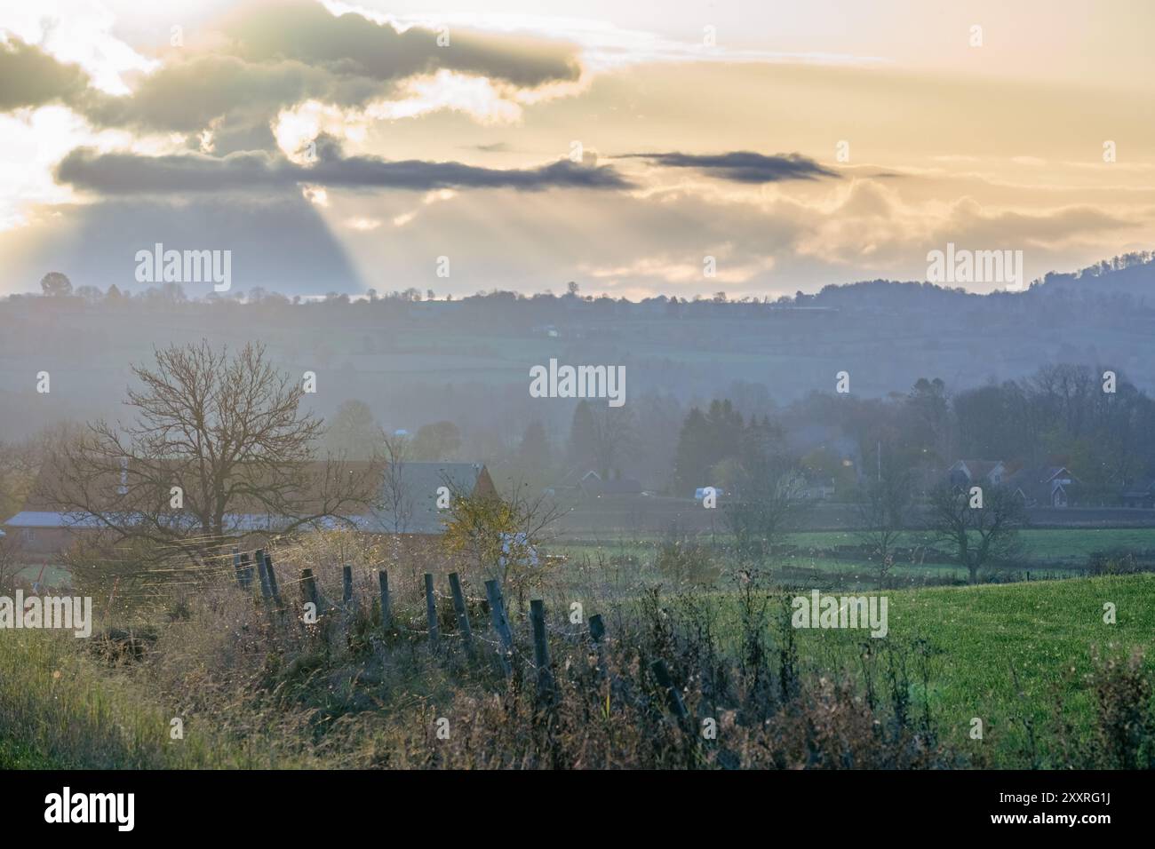 Rural landscape view with barns and fence Stock Photo - Alamy
