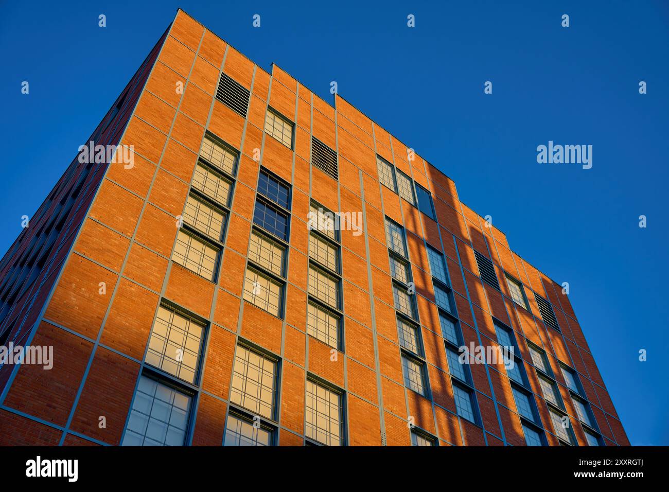 Modern brick office buildings against blue sky. Architectural detail of ...