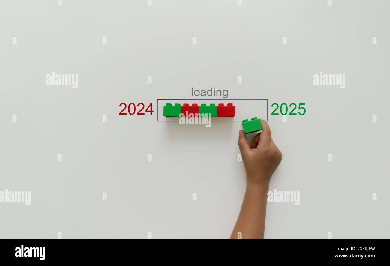 Loading new year 2024 to 2025 with child hand putting green plastic ...