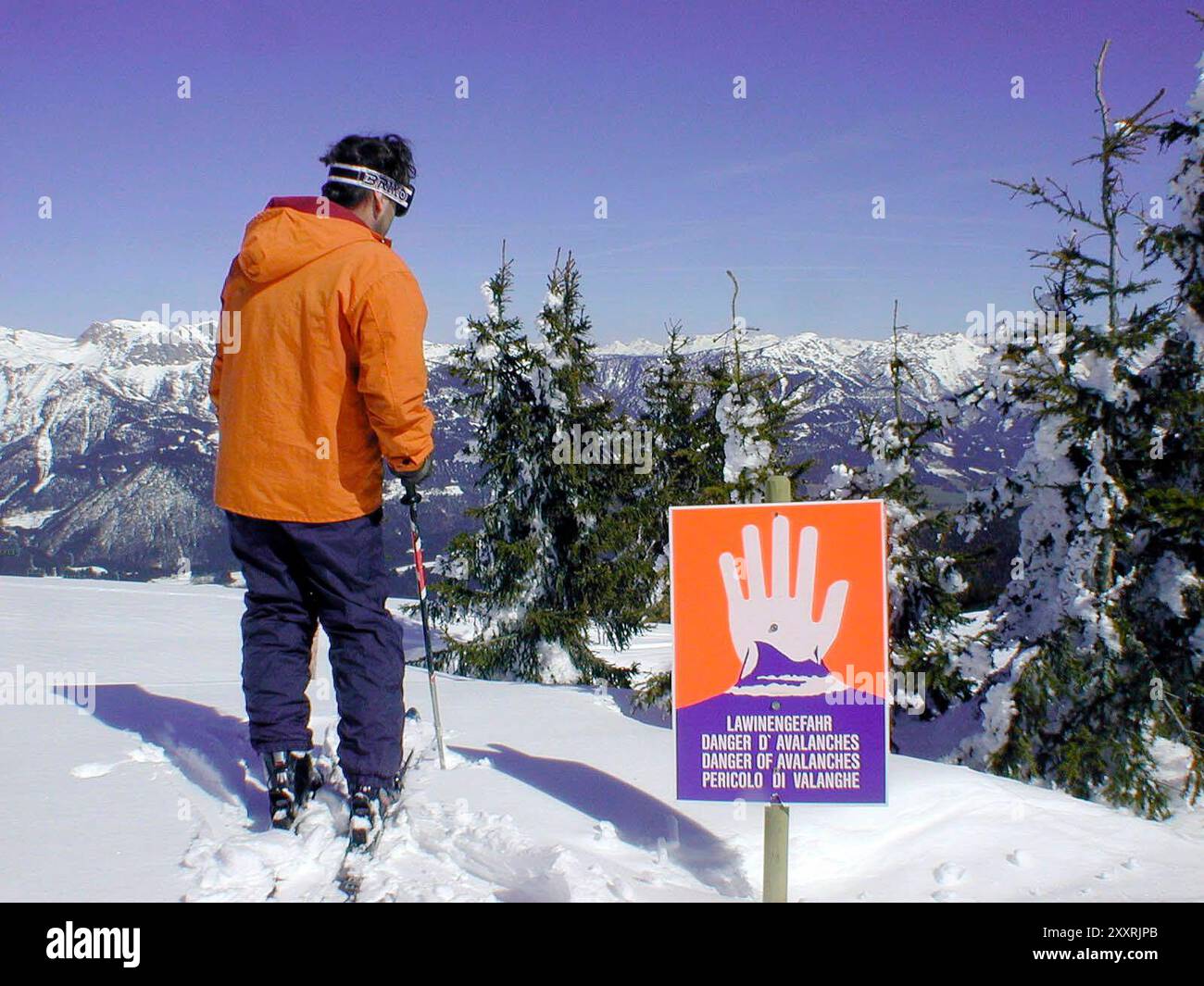 a danger of avalanches warning sign on a snowy ski area danger of ...