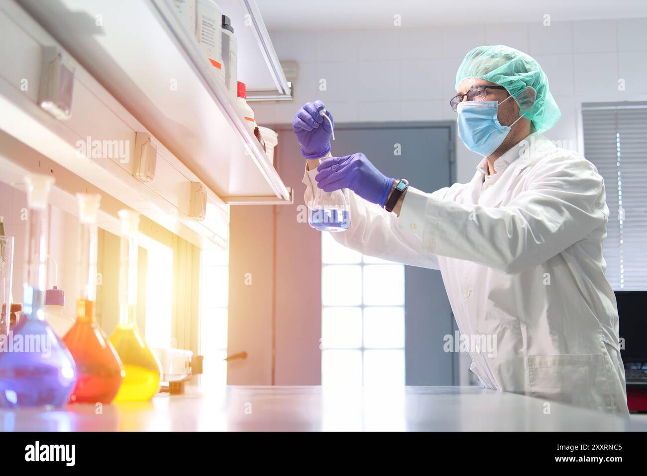 Scientist Conducting Experiment in Laboratory Setting Stock Photo - Alamy