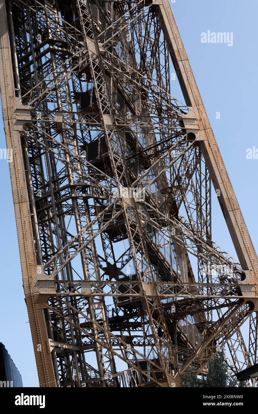 Paris, France - 08 22 2024: View of a pylon and staircase of the Eiffel ...