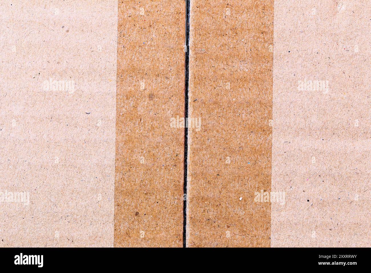 Top of cardboard with adhesive tape on it, adhesive tape traces on a ...