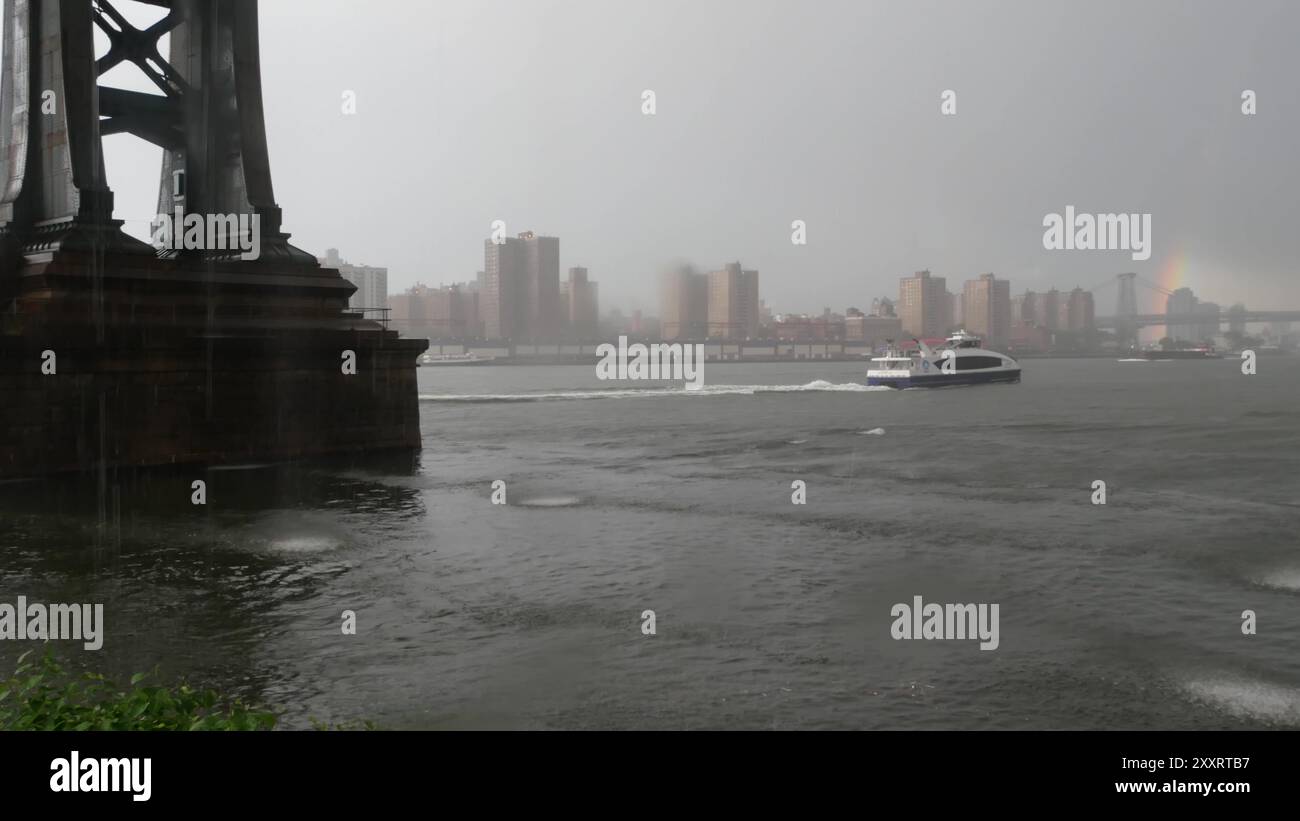Rainy New York City under Manhattan Bridge in Brooklyn. Rainbow from ...