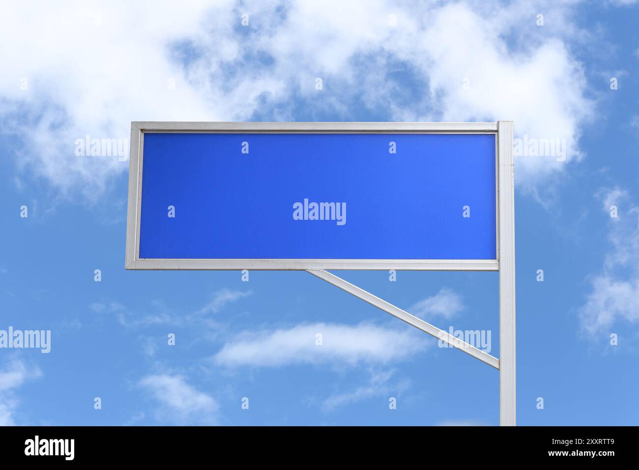 Empty blue sign with a background of a blue sky and white clouds, use ...