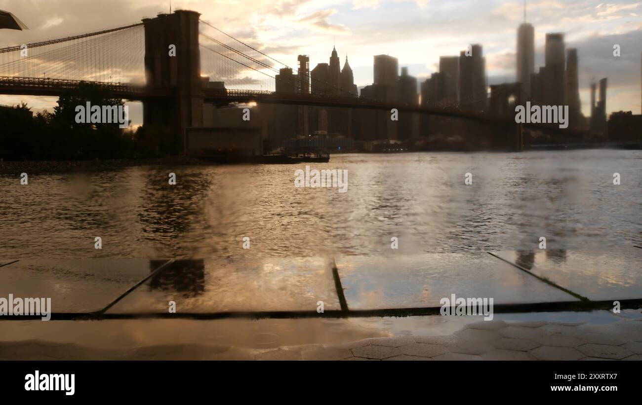 Brooklyn Bridge, rainy foggy day. New York City Manhattan downtown ...
