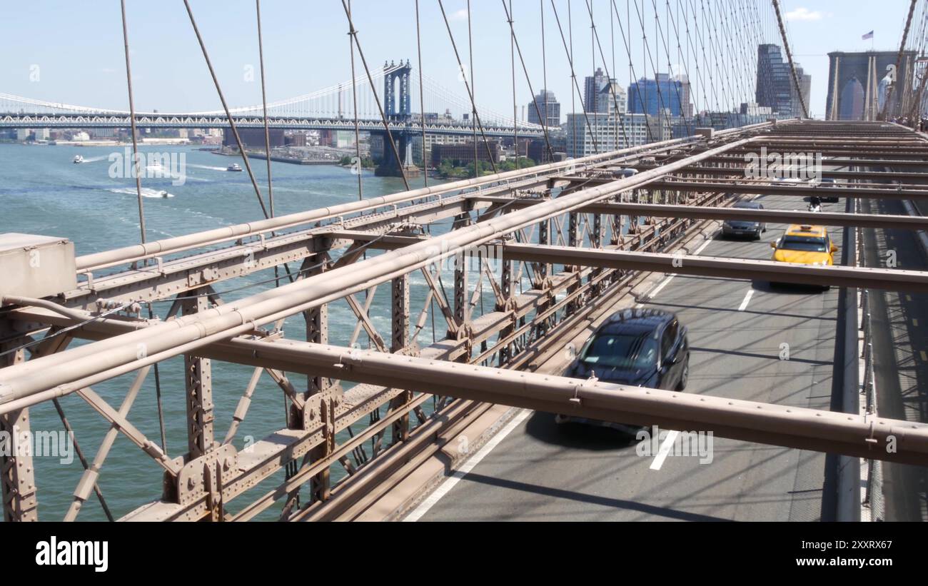 Cars on Brooklyn Bridge, New York City Manhattan Bridge view. Yellow ...