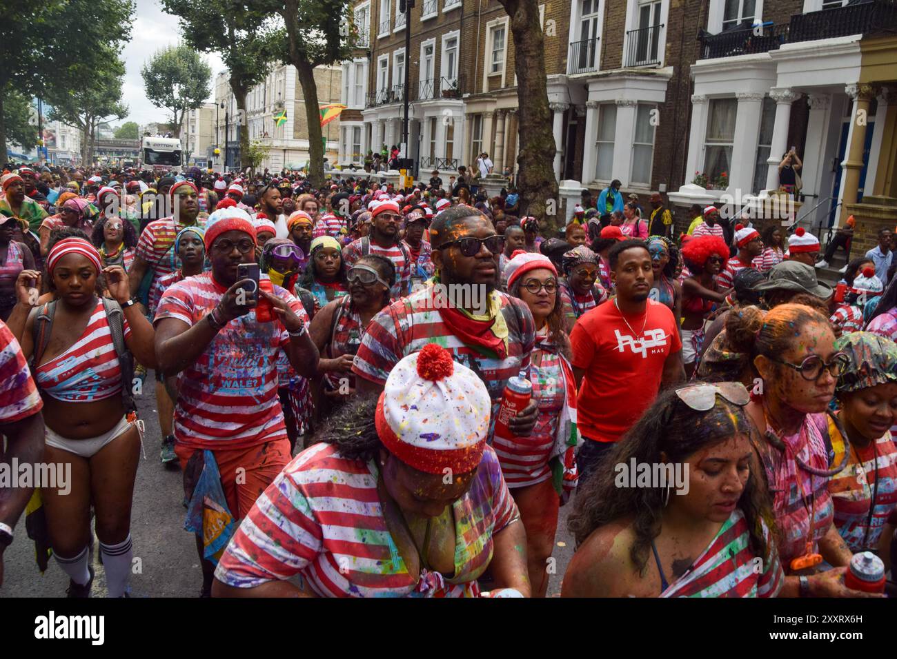 London, UK. 25th August 2024. Revellers dressed as children's puzzle ...