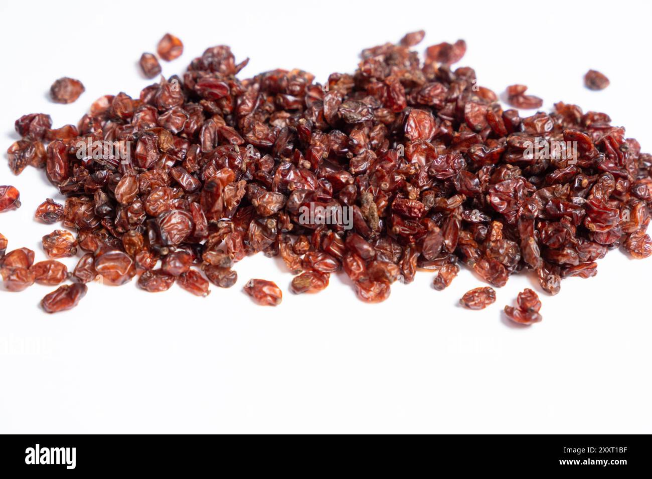 Red dried barberry on white background Stock Photo - Alamy