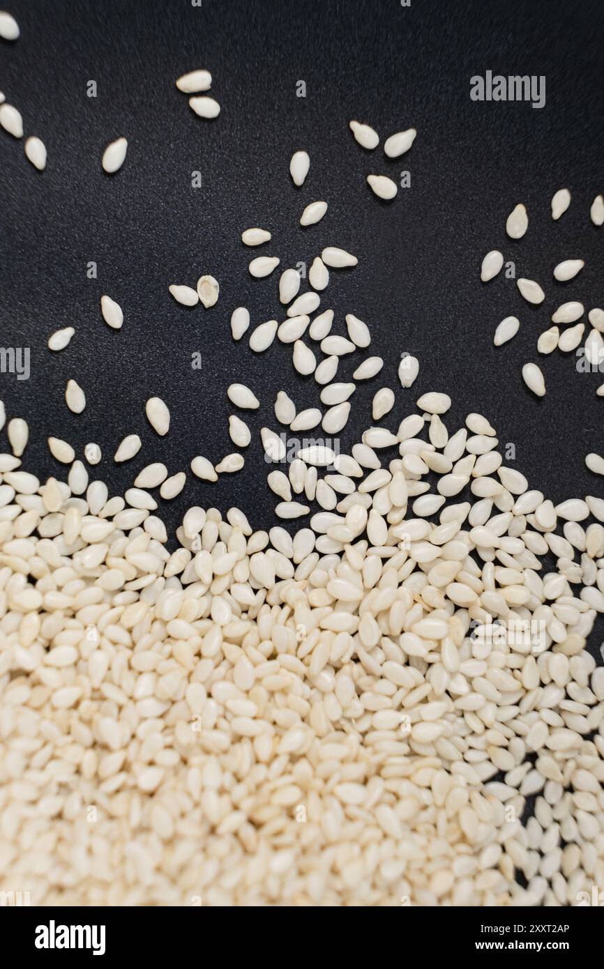 Macro kernels of white roasted sesame seeds Stock Photo - Alamy
