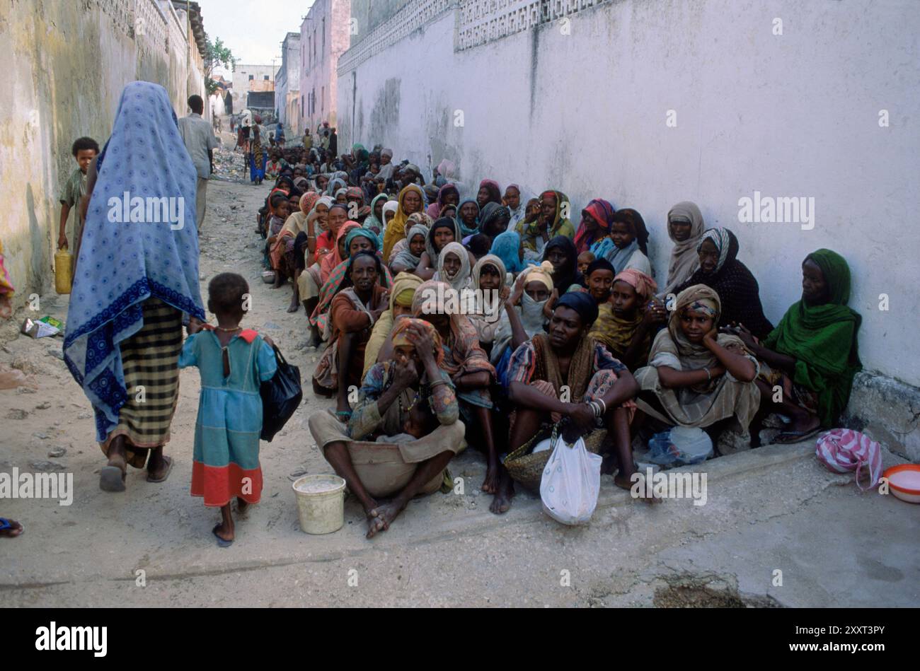 Malnourished people wait for food distribution in Baidoa, Somalia Stock ...