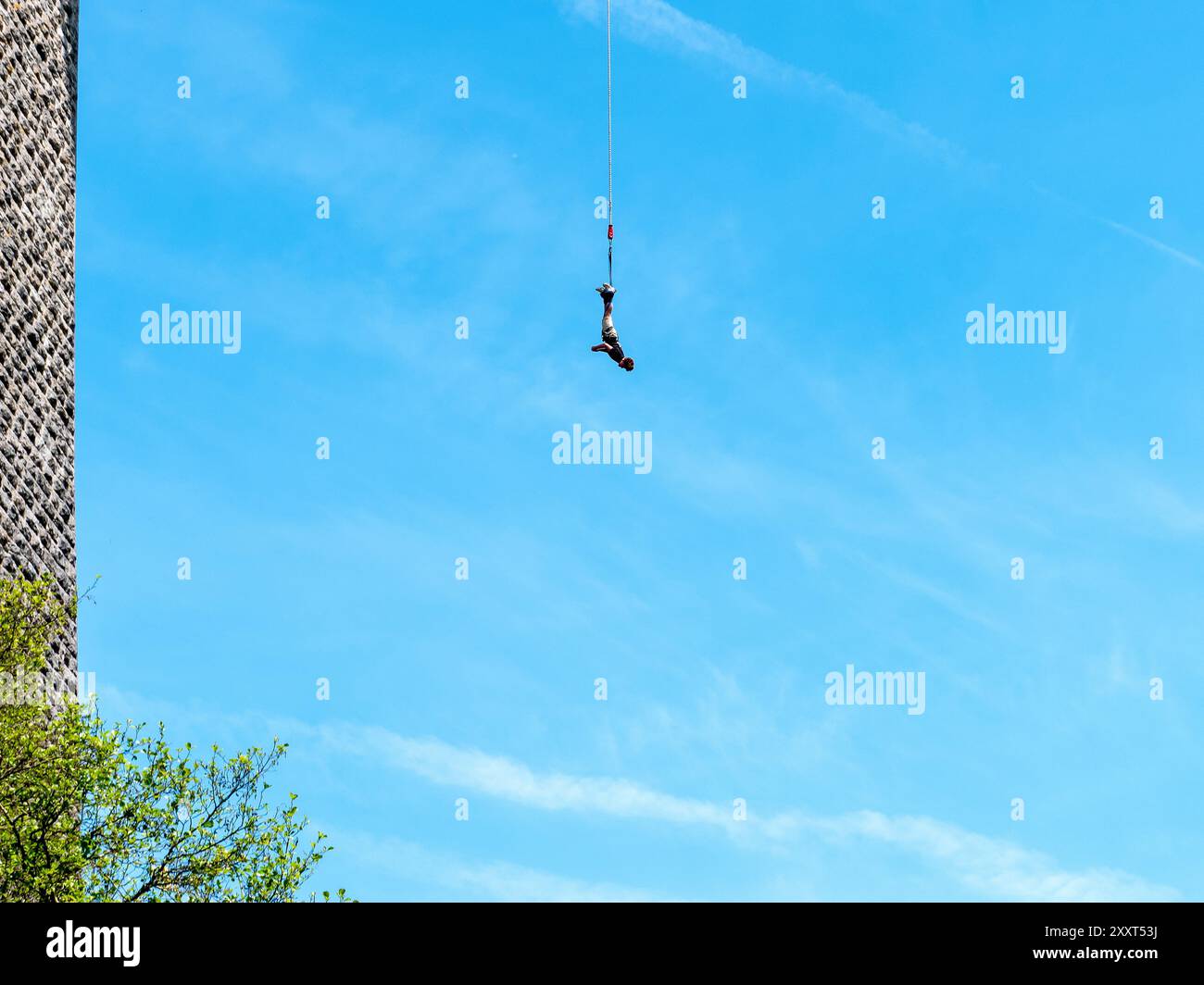 Clecy, Normandy, France, May 10, 2024. Jumping on a bungee cord in ...