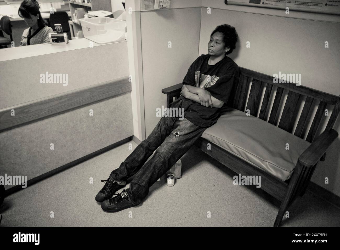 A homeless young man rests after dialysis treatment at a clinic in ...