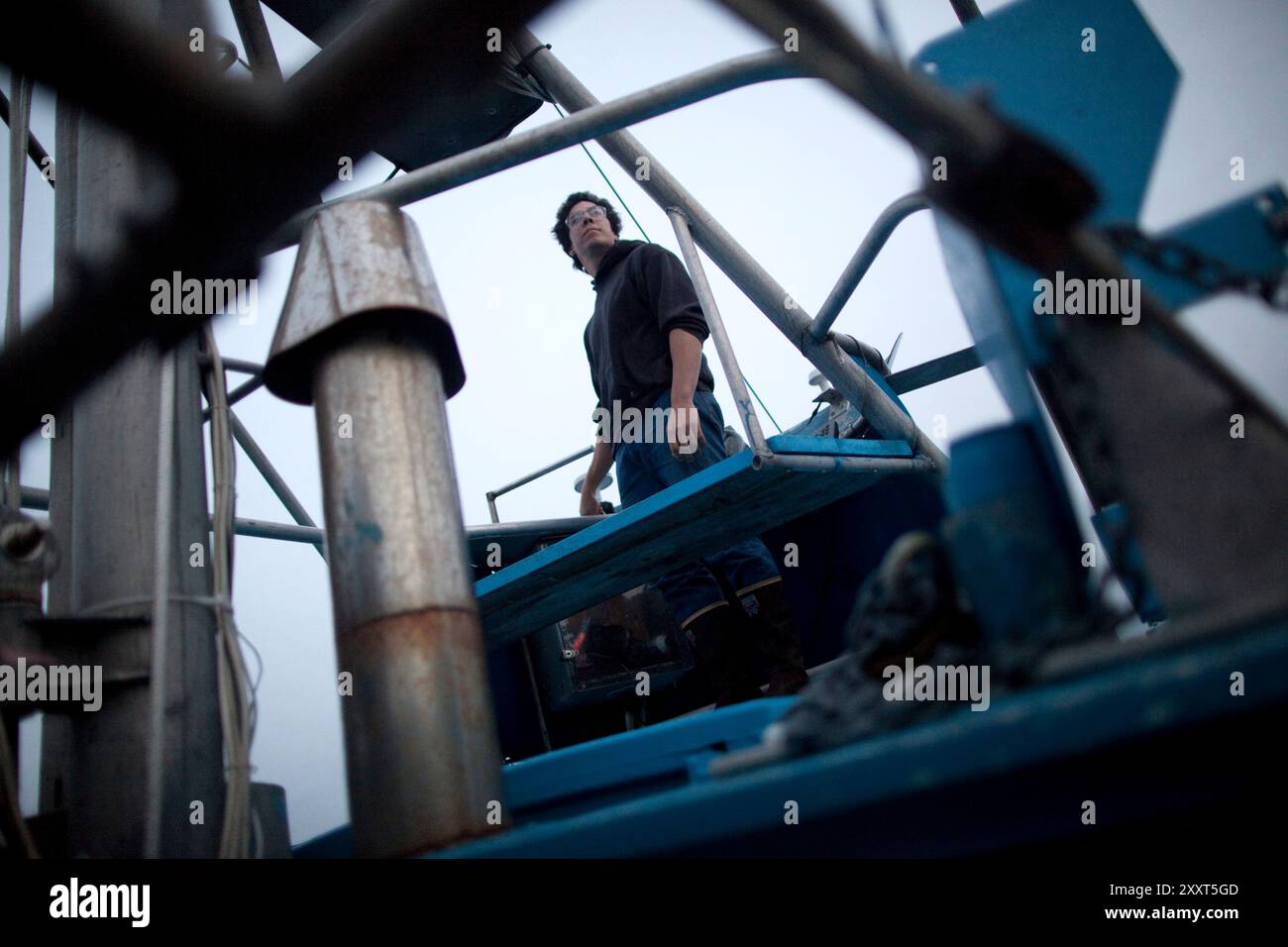 A man pilots his salmon gillnetting vessel Loki in Puget Sound near ...