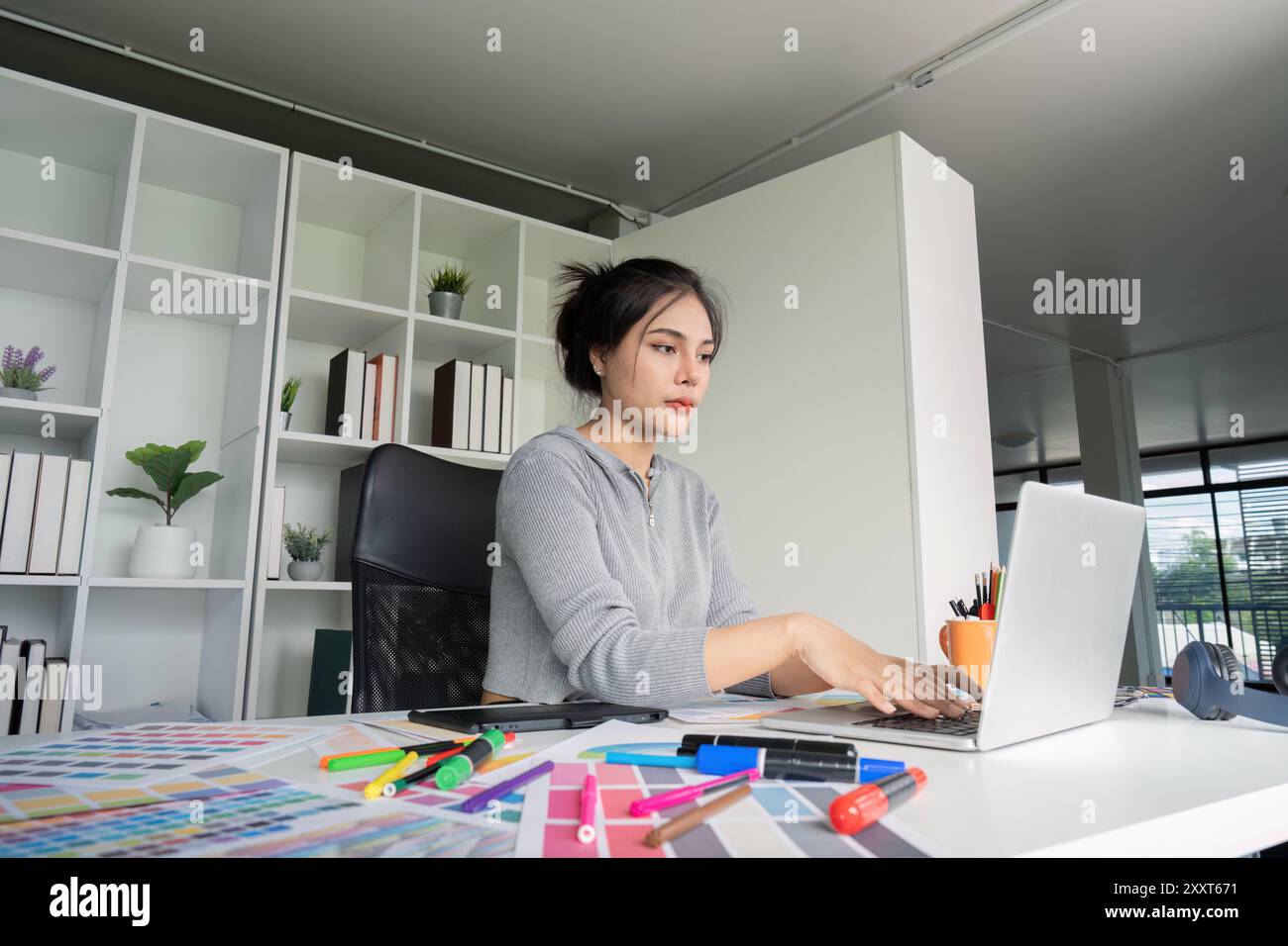 Focused graphic designer analyzing hi-res stock photography and images ...