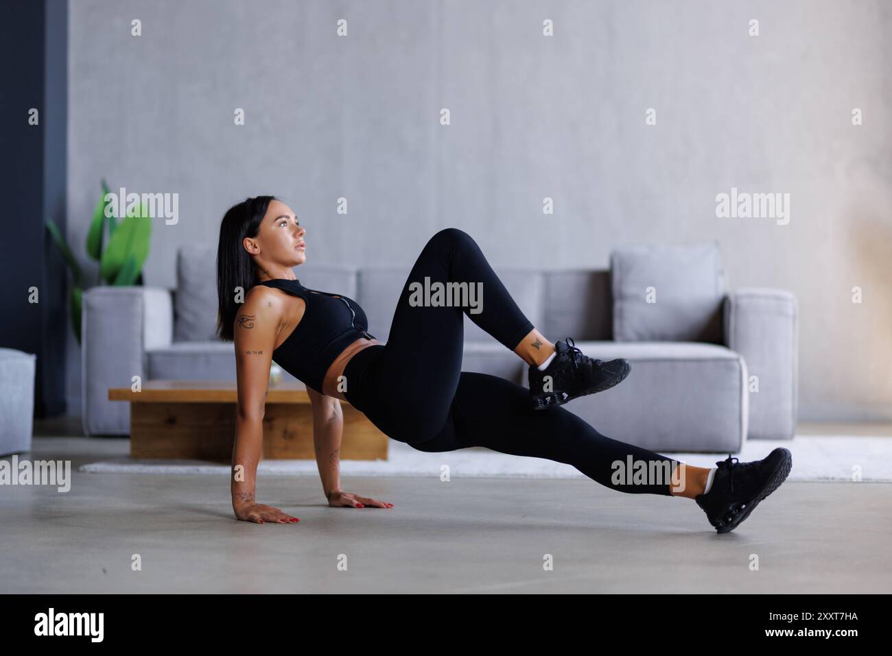 Young attractive yogi woman practicing yoga concept, standing in Purvottanasana exercise, One ...