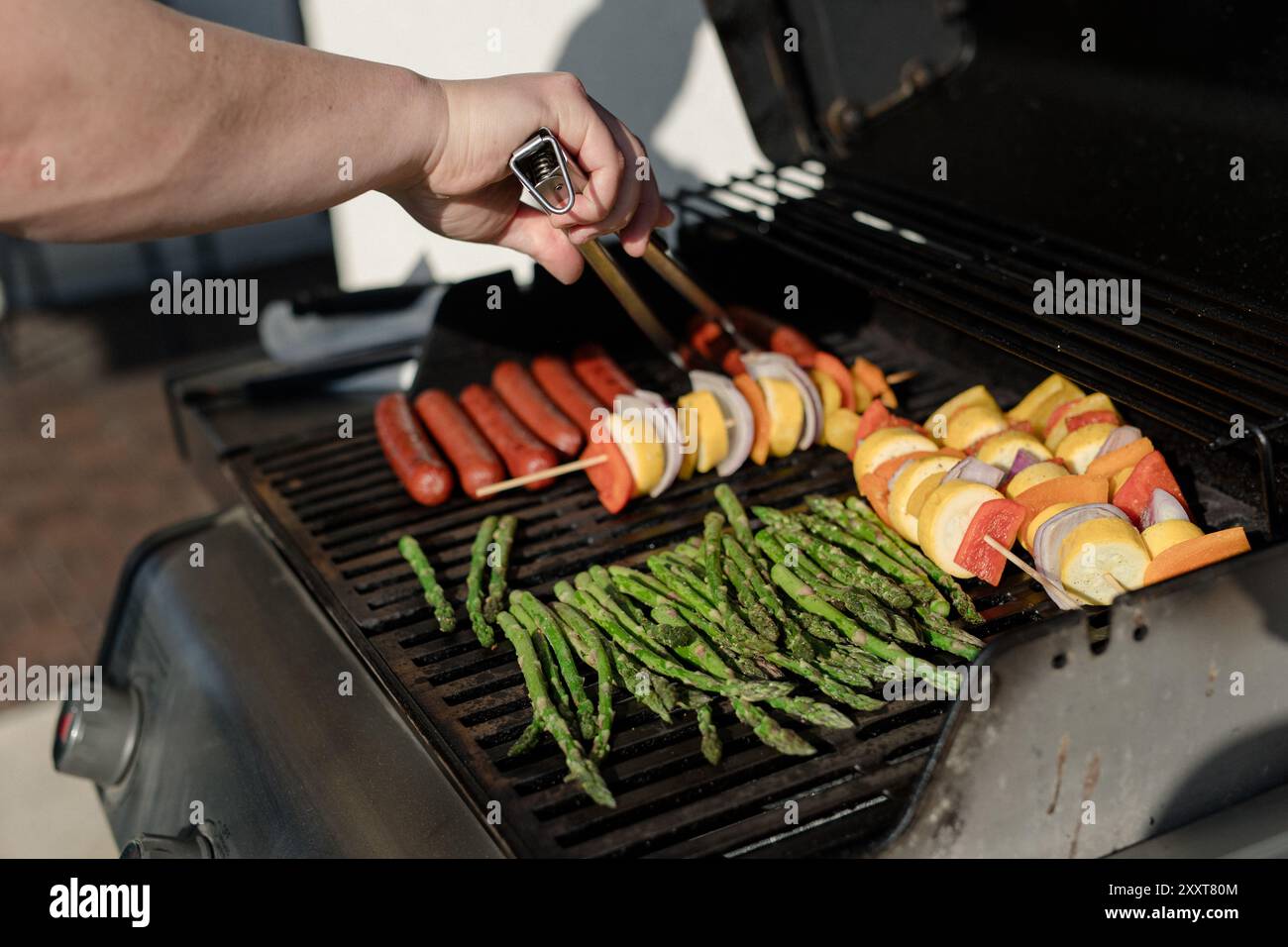 Barbecue on grill cooking hand hi-res stock photography and images - Alamy