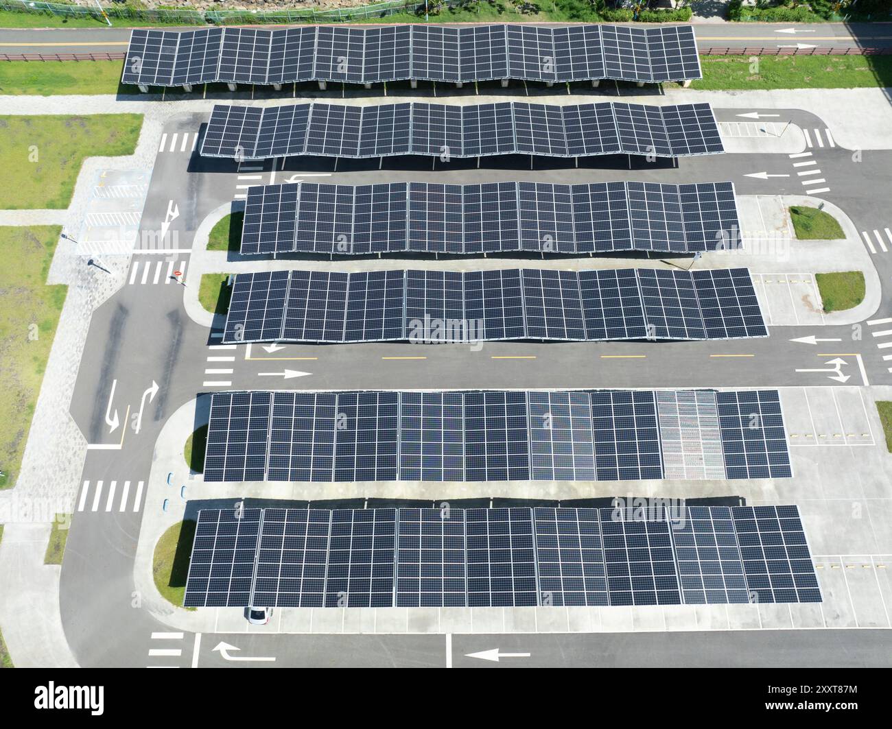 Aerial view above innovative solar panels located on a car parking lot ...