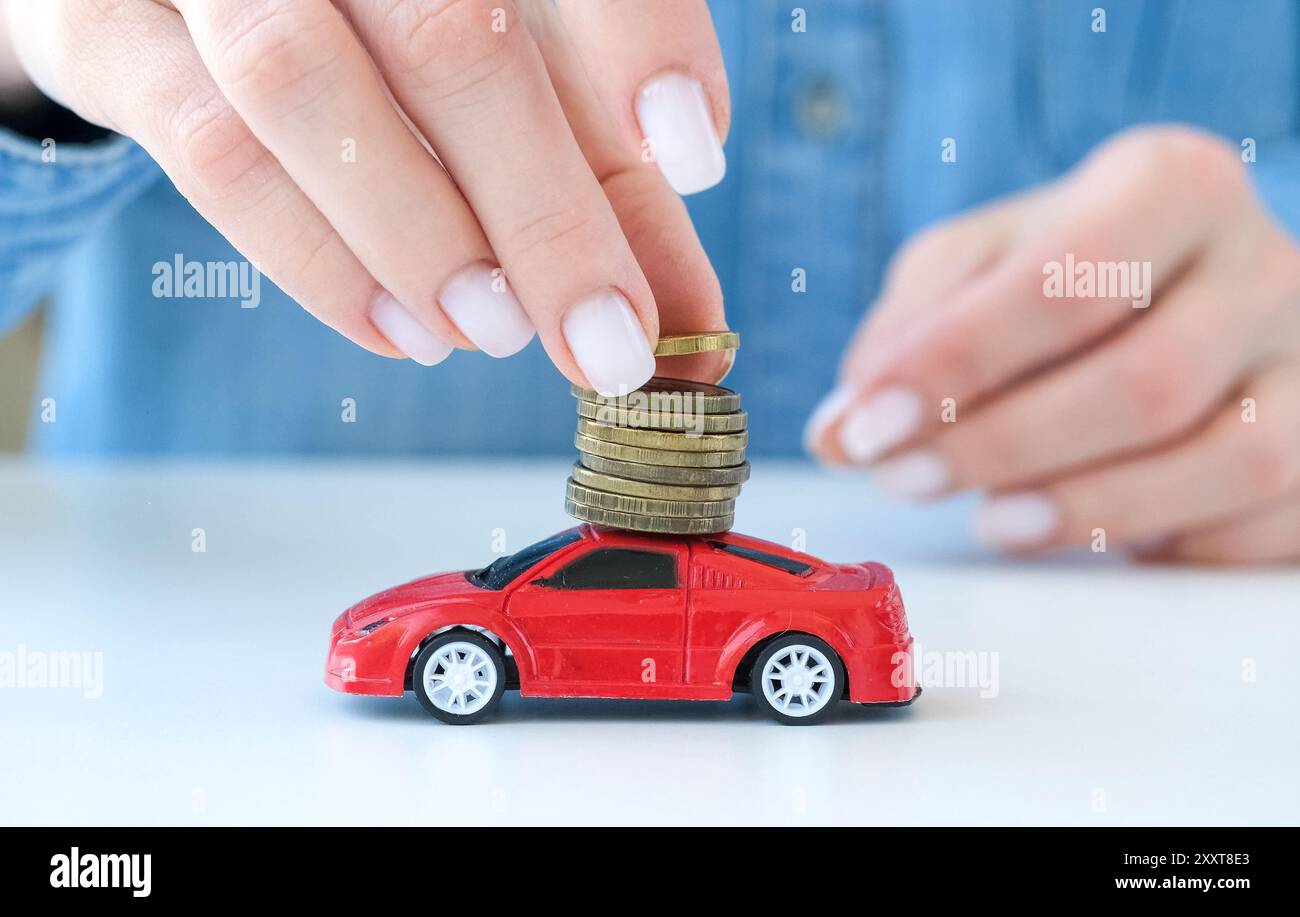 Hand money toy car hi-res stock photography and images - Alamy