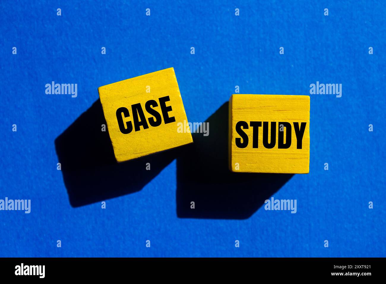 Case study message written on wooden yellow cubes with blue background. Conceptual case study ...