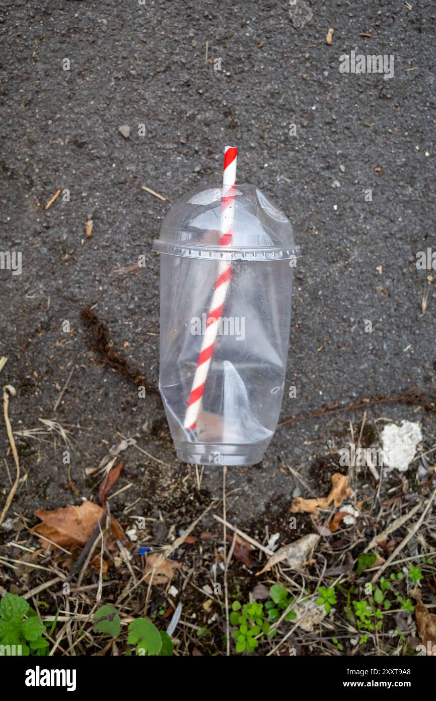 Clear plastic cup with red and white striped straw Stock Photo - Alamy