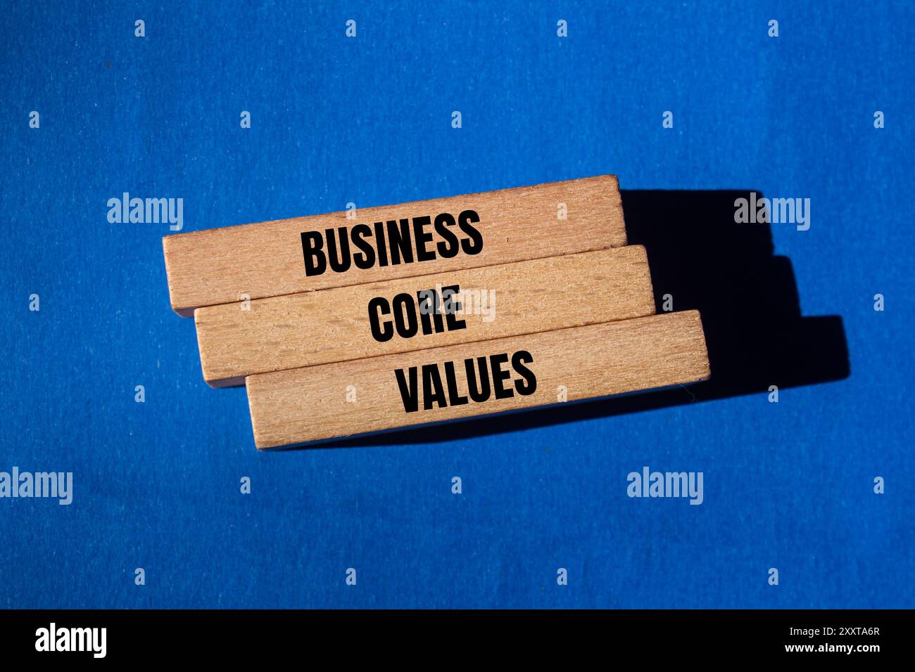 Business core values message written on wooden blocks with blue ...