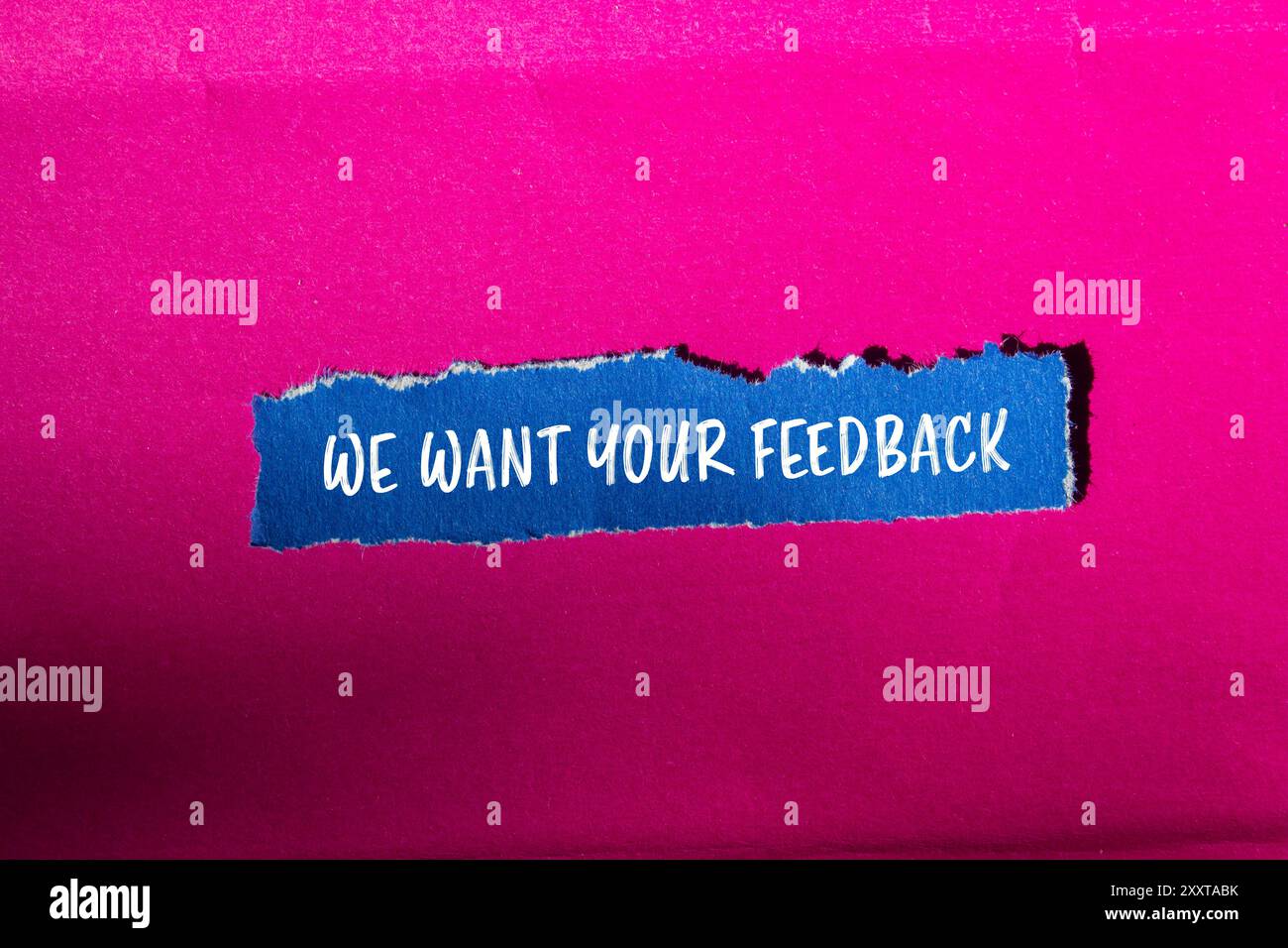 We want your feedback message written on ripped blue paper piece with ... We want your feedback message written on ripped blue paper piece with ...