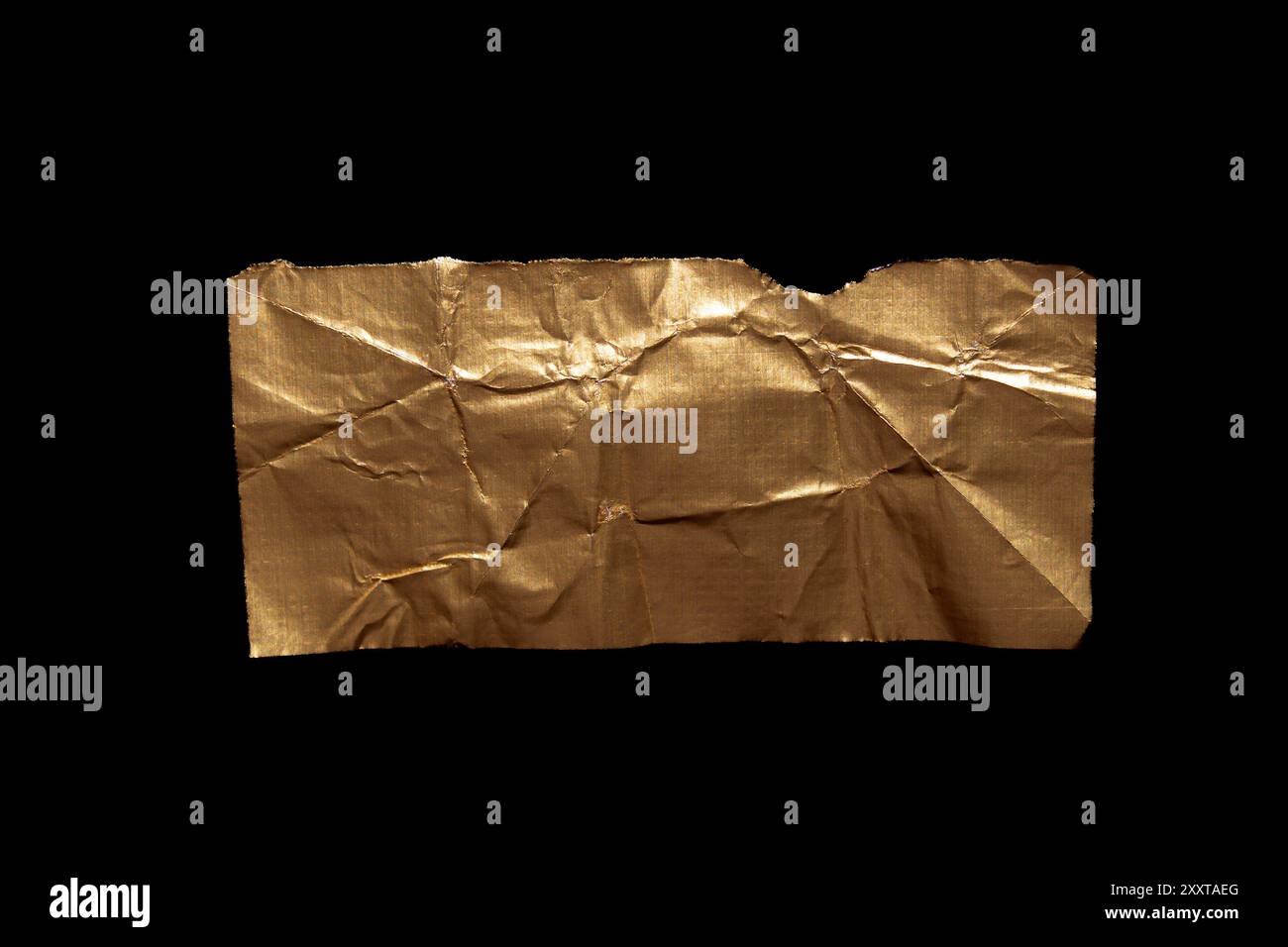 Ripped torn golden paper piece on isolated black background Stock Photo ...