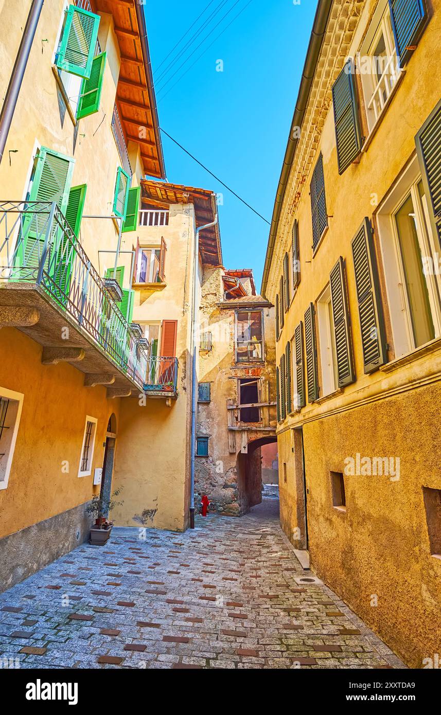 The narrow streets and colored houses in old town of Carona, Ticino ...