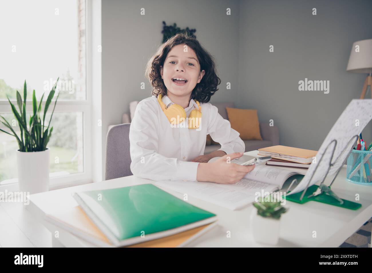 Photo of charming cute nice small boy schoolkid wearing white shirt ...