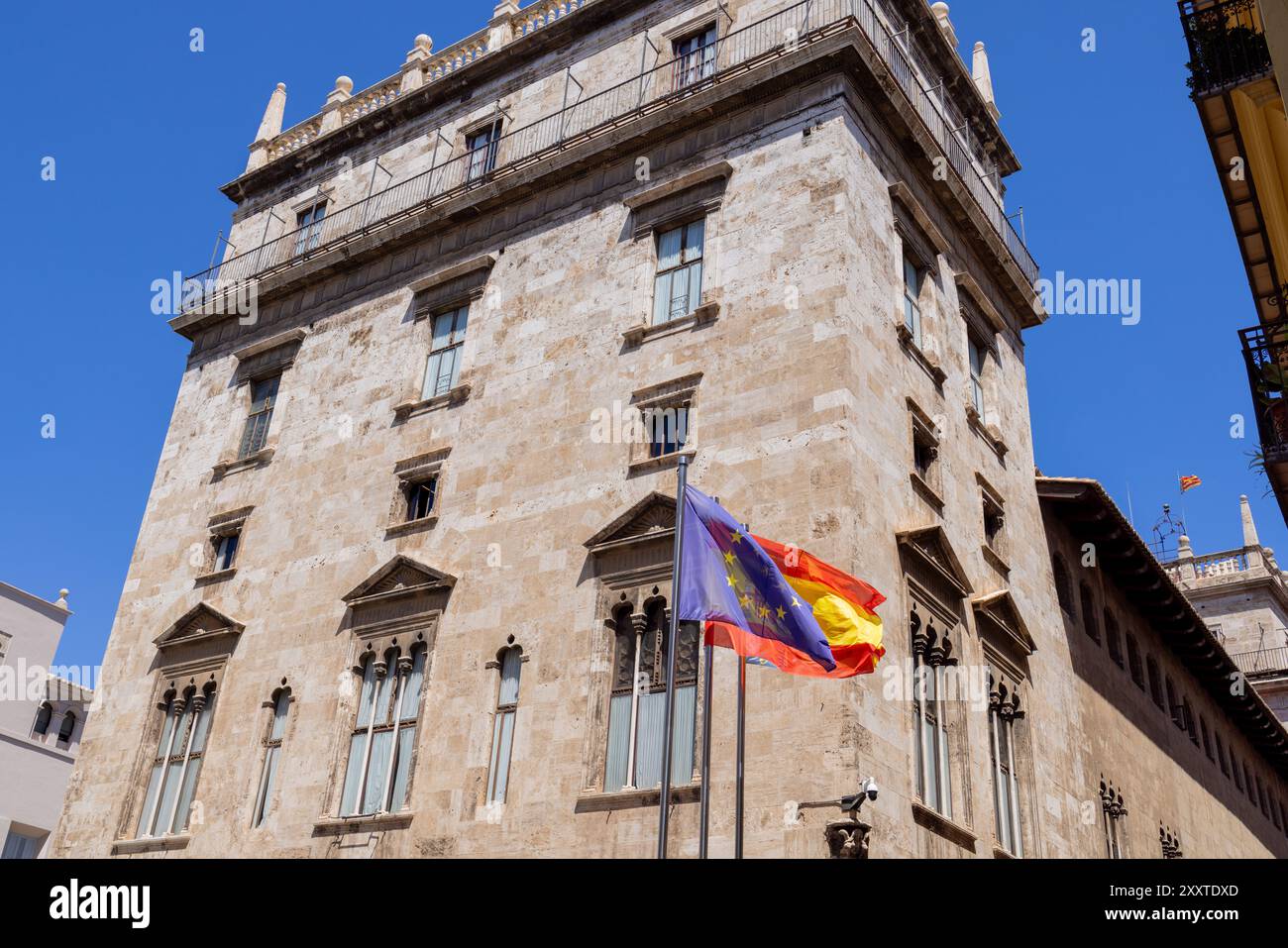 Photo of a selection of 3 spanish flags on a yellow building in the ...