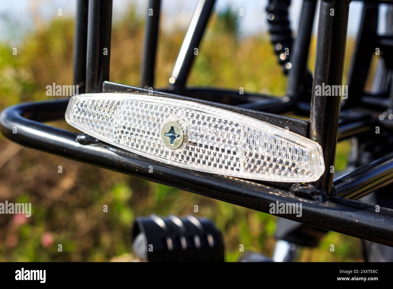 White reflective reflector on bicycle mounted at front Stock Photo - Alamy