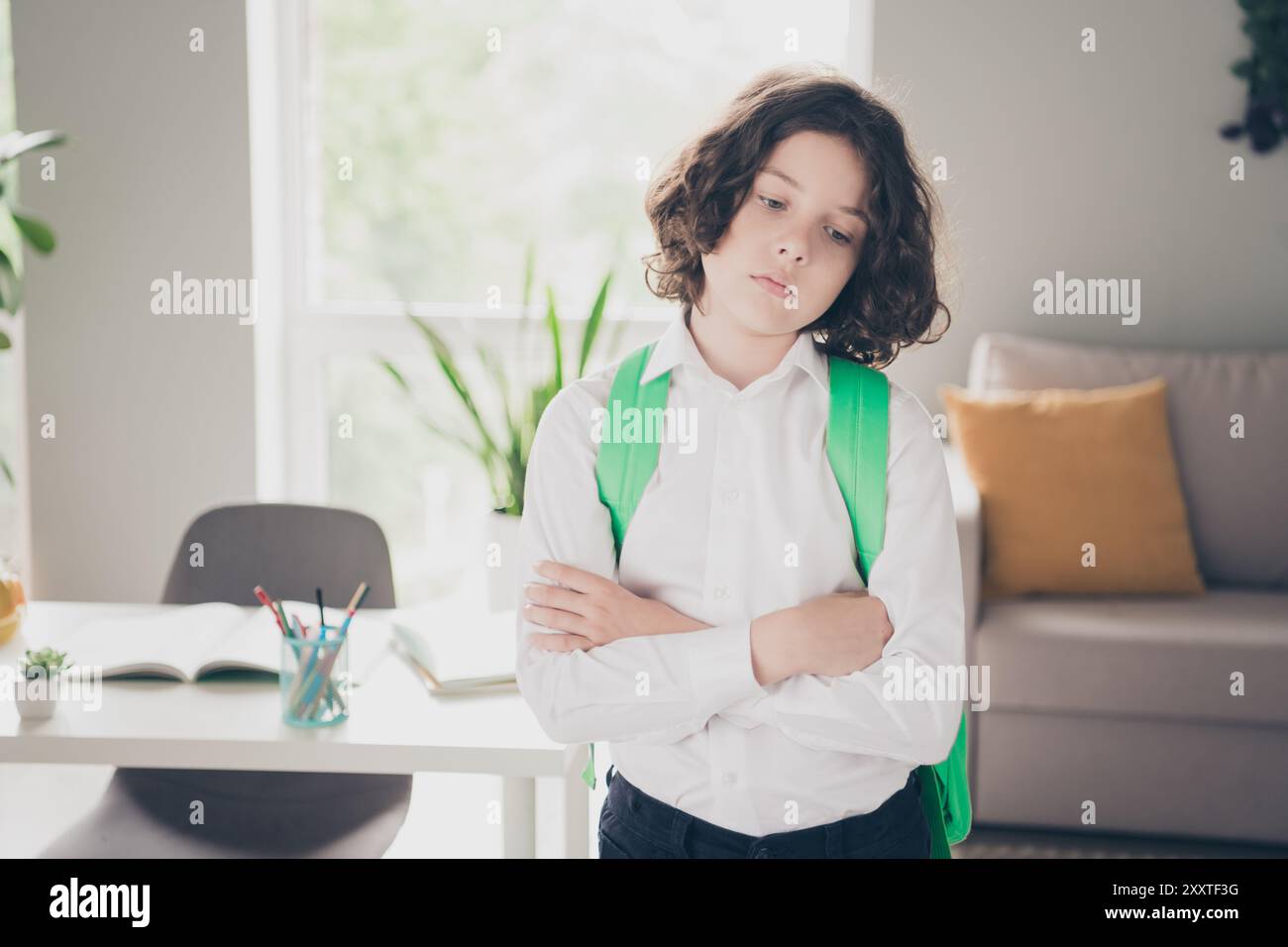 Photo of sad disappointed little boy schoolchild wearing white shirt ...