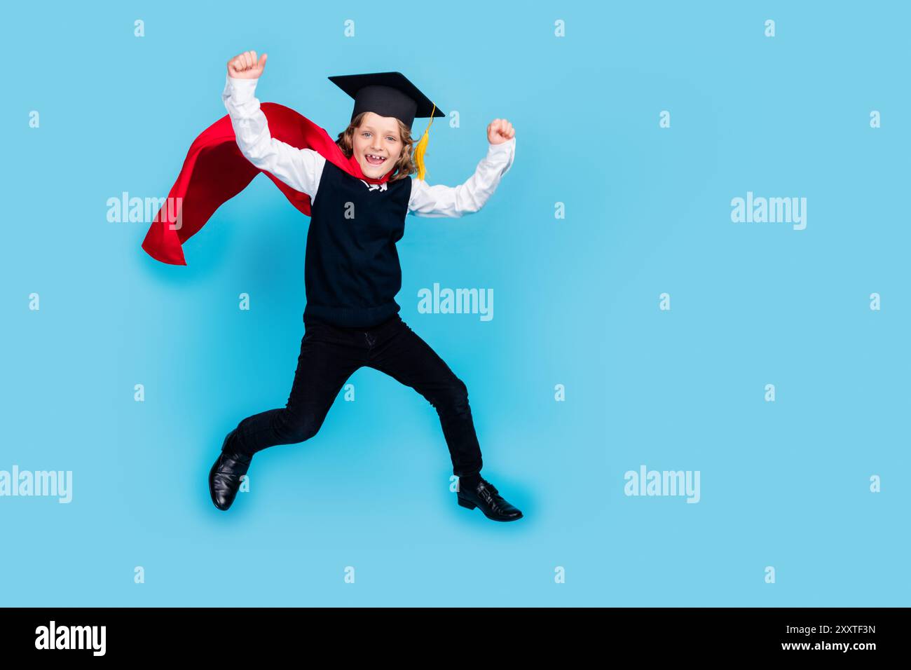 Full length portrait of little schoolchild boy wear uniform mortarboard ...