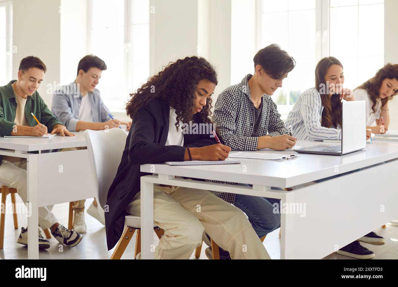 Students Engaged In Learning Activities In Classroom During Lesson Or ...