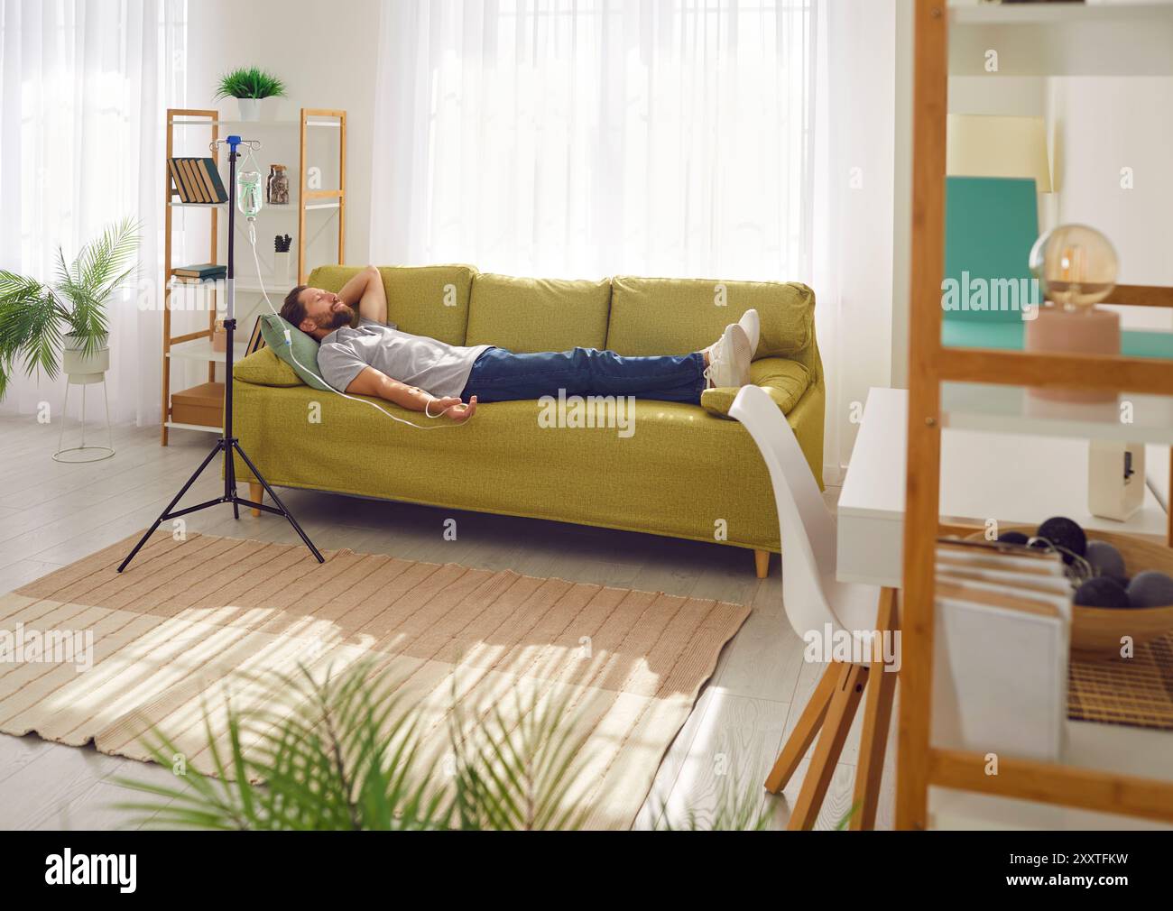 Happy, relaxed man getting an intravenous vitamin injection on the ...