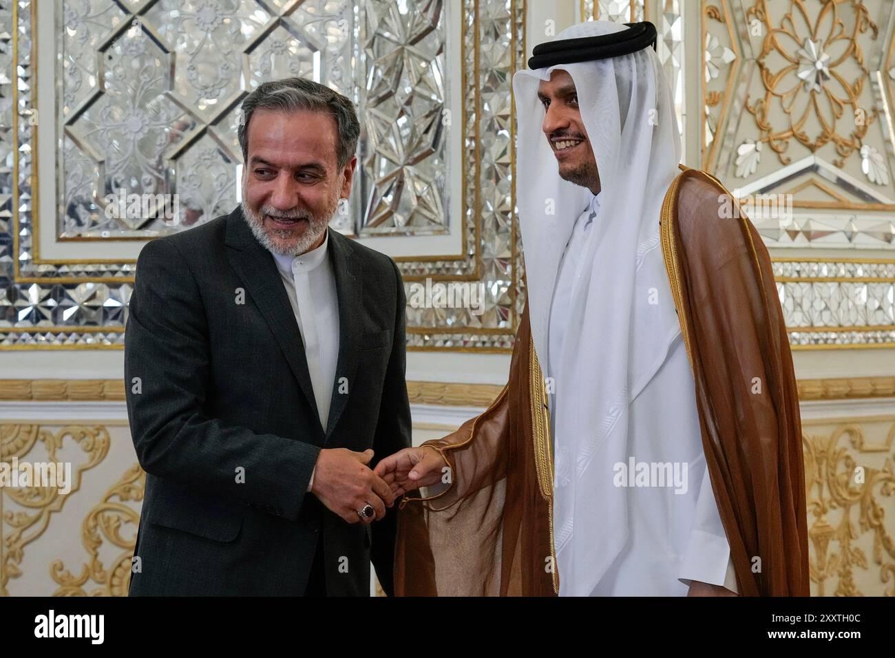Iranian Foreign Minister Abbas Araghchi, left welcomes Qatari Prime ...
