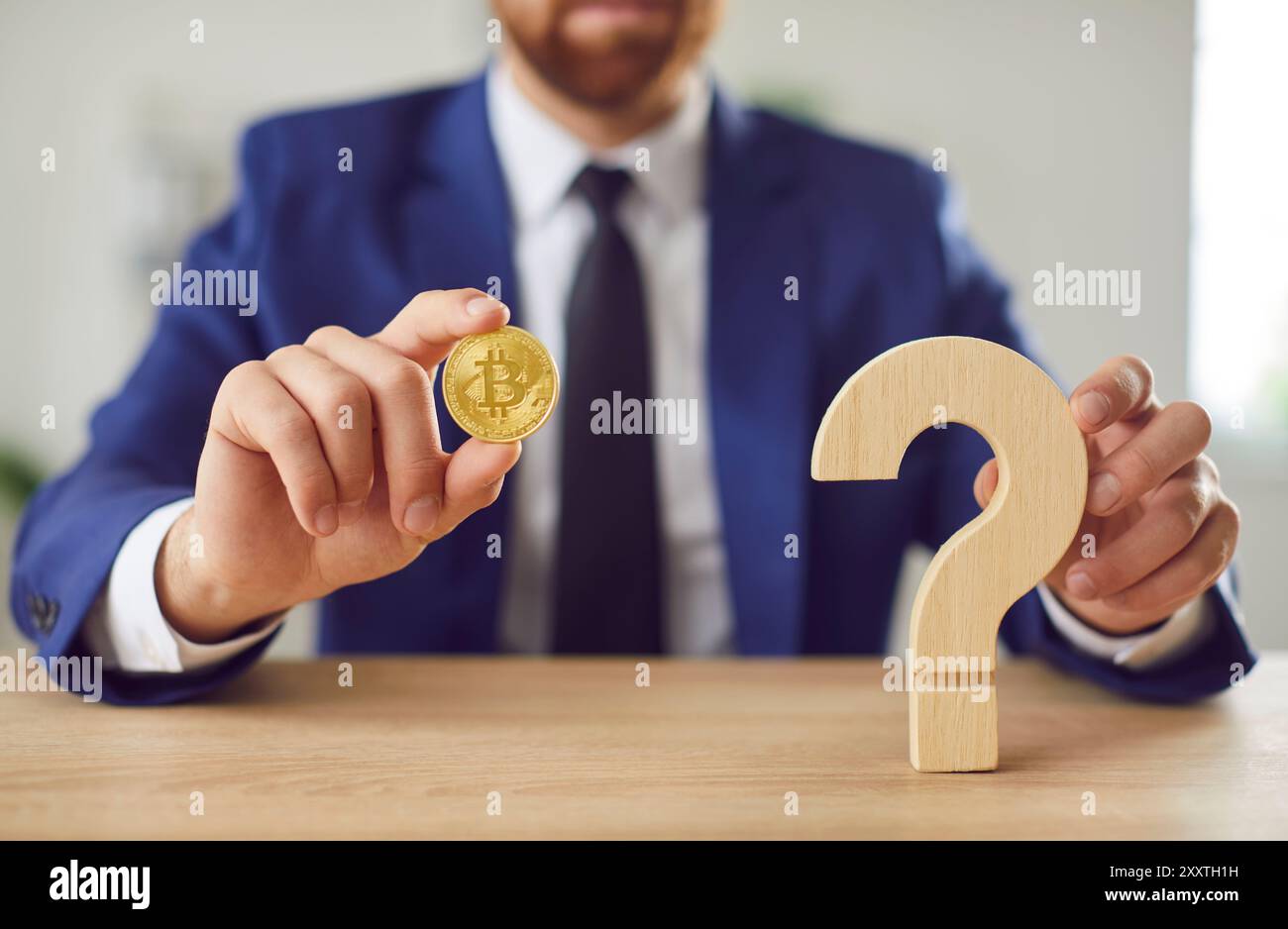 Man Holding Bitcoin Coin And Question Mark Stock Photo - Alamy