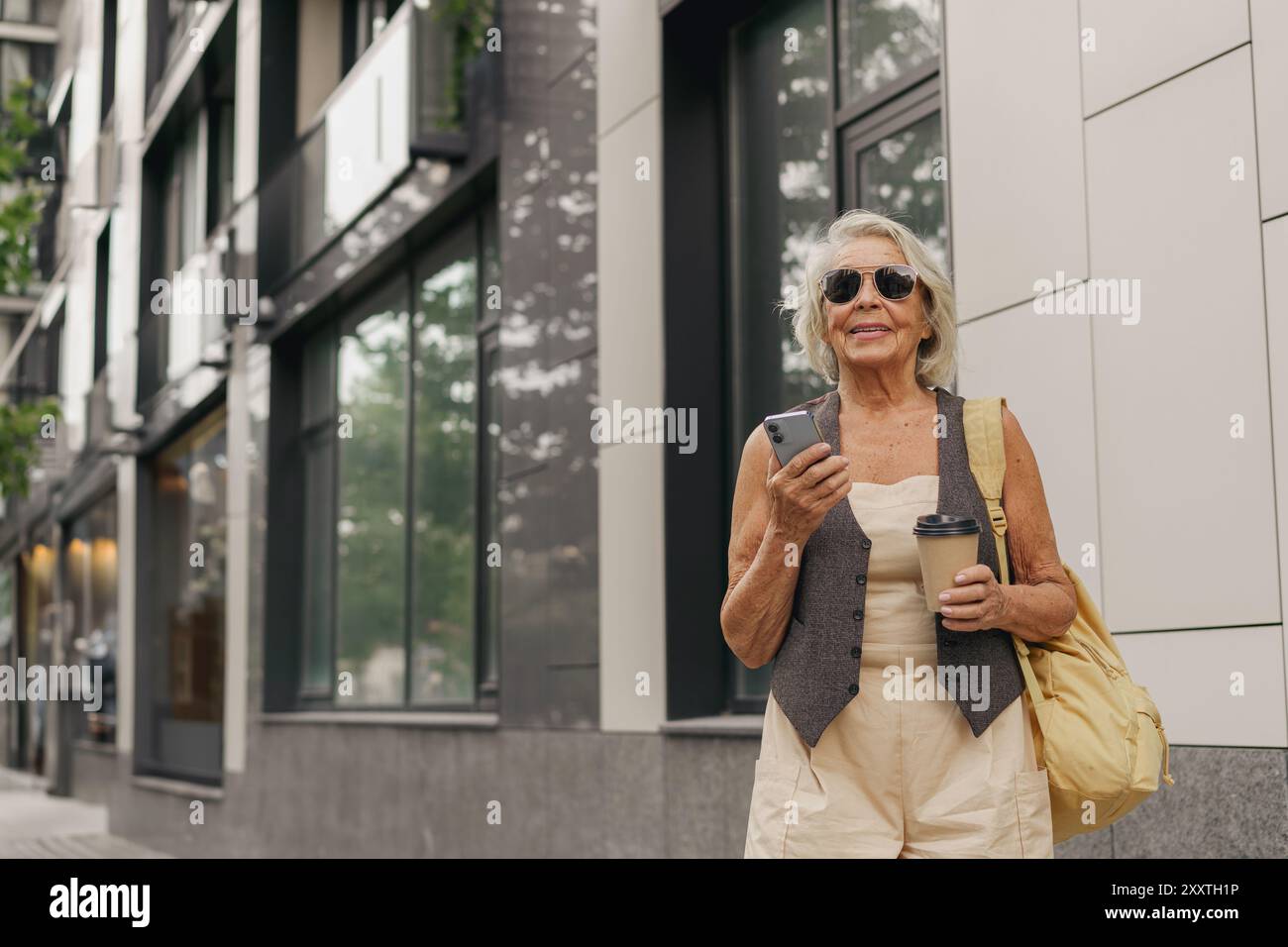 An Elegant Senior Woman Is Enjoying a Beautiful Day Out in the City ...