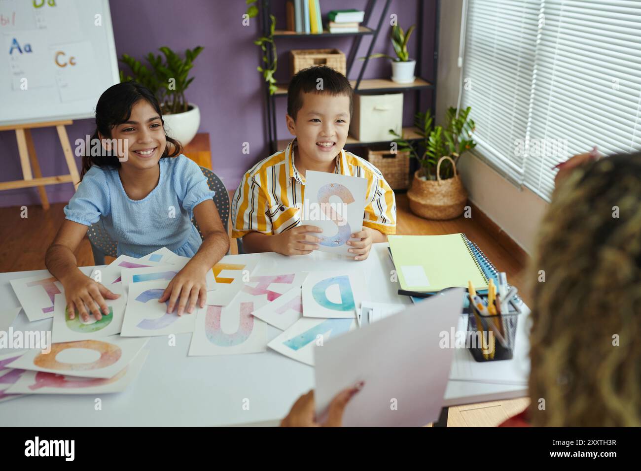 Engaging in Classroom Learning Activities with Children Stock Photo - Alamy
