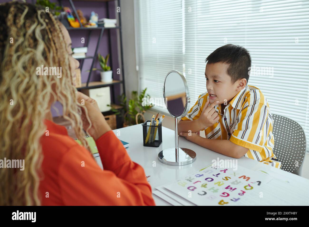 Engaging in Child Therapy Session With Mirror Interaction Stock Photo ...