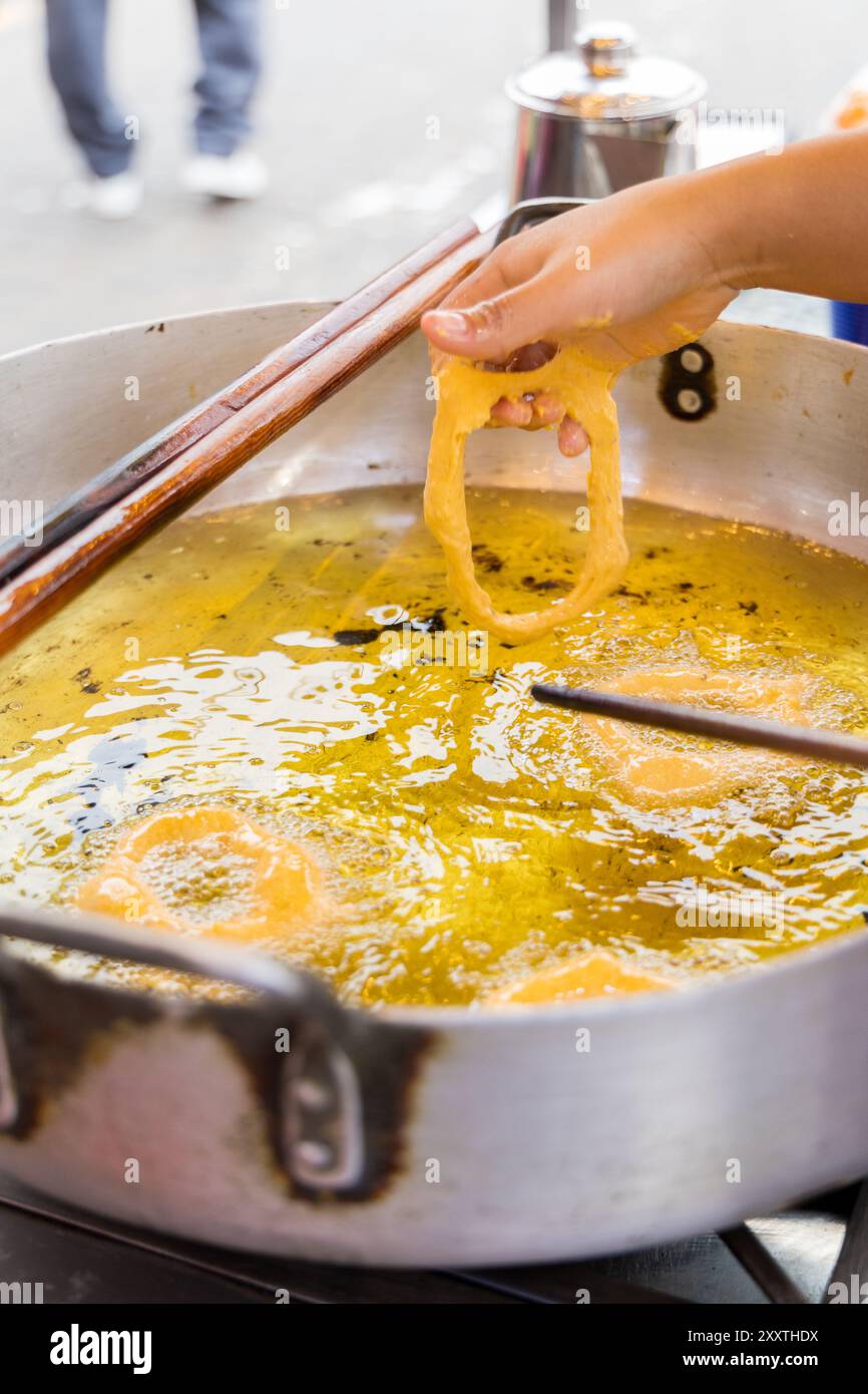 Woman cooking picarones in hi-res stock photography and images - Alamy