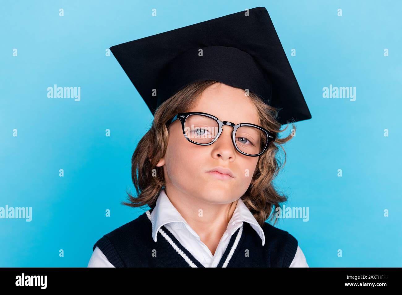 Photo of smart clever diligent boy wear uniform finish elementary ...