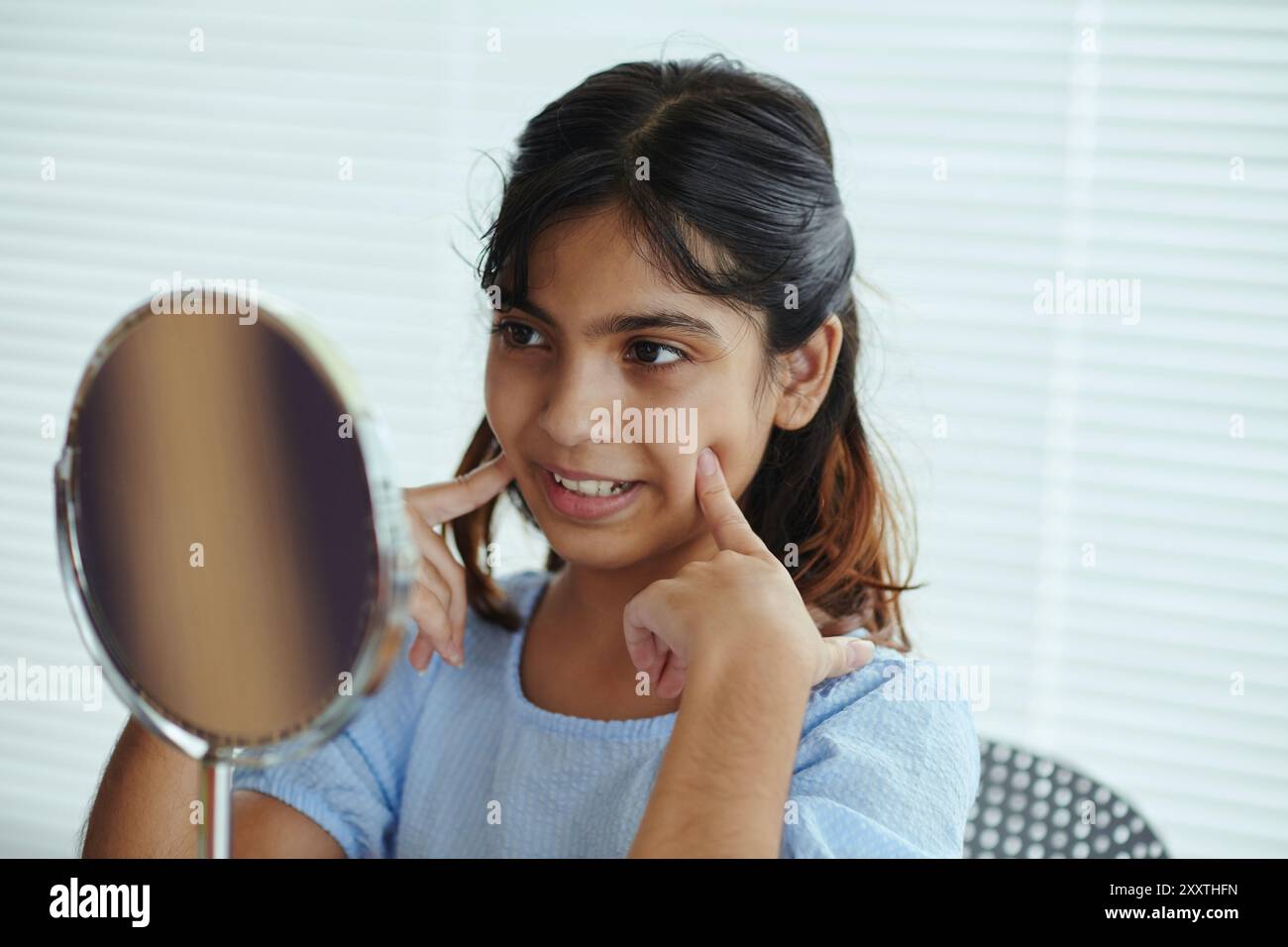 Girl Practicing Facial Expressions in Front of Mirror Smiling Stock ...