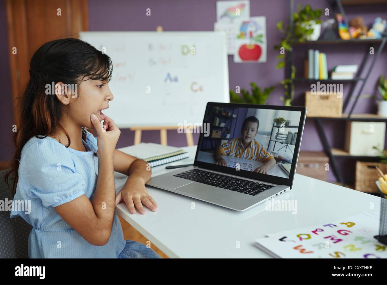 Engaging in Online Learning Session with Tutor Stock Photo - Alamy