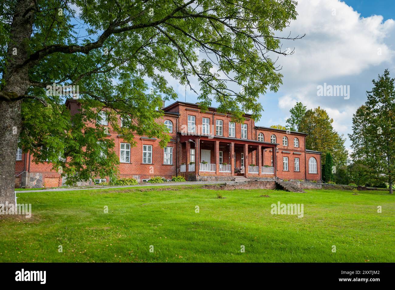 Red brick manor in Allikukivi, Estonia. Allikukivi manor with its ...