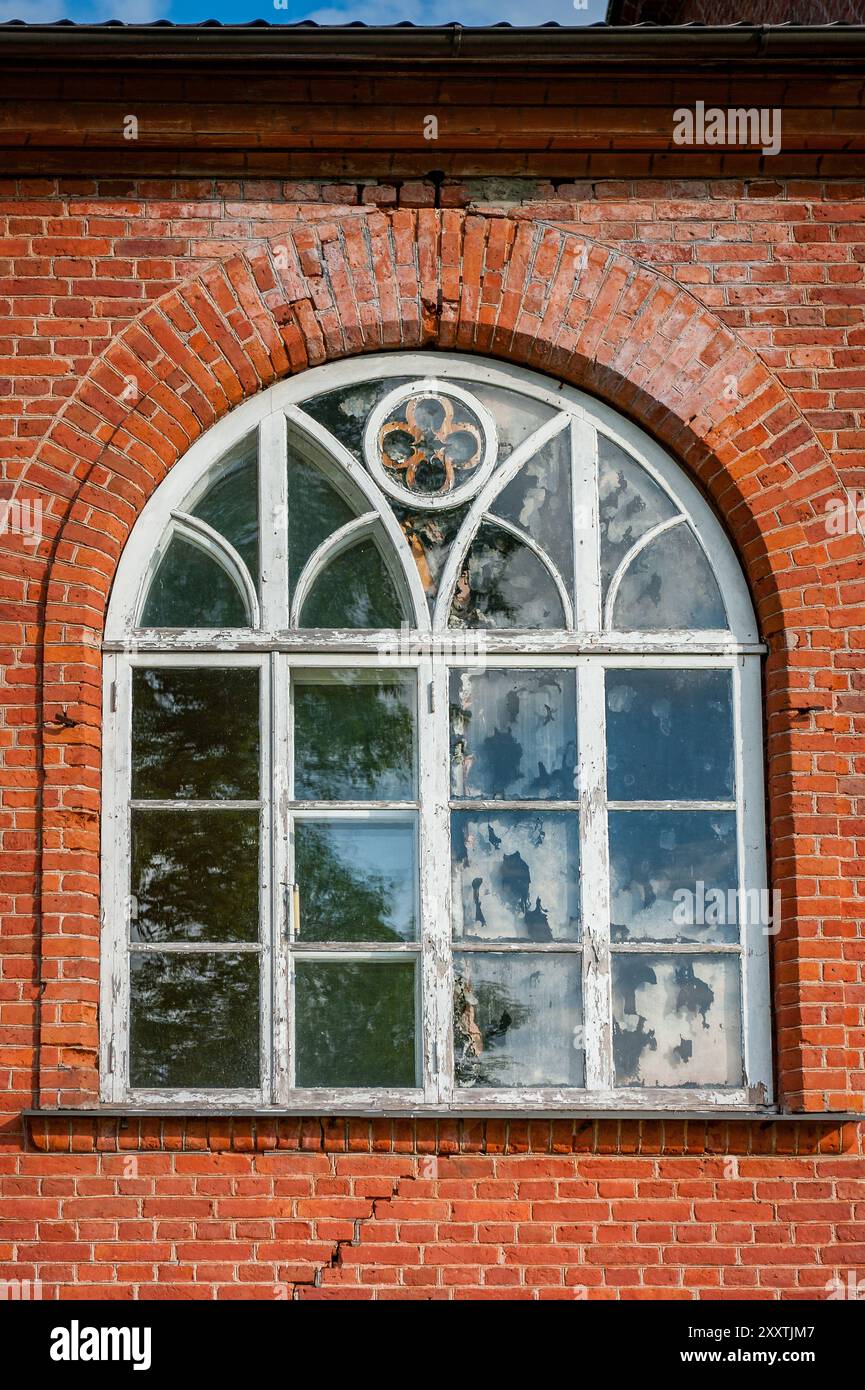 Old arched window of red brick manor Stock Photo - Alamy
