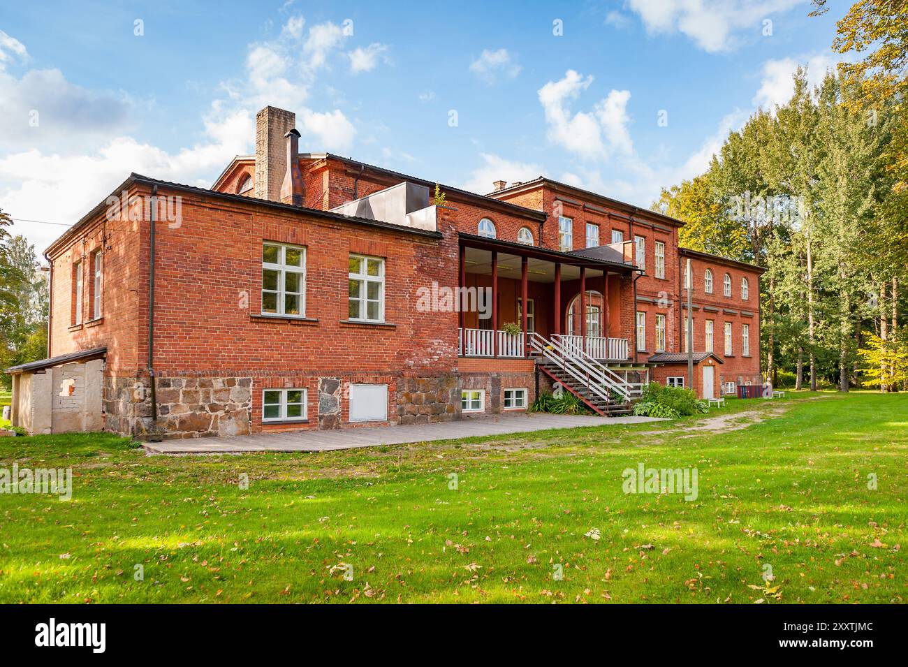 Red brick manor in Allikukivi, Estonia. Backyard Stock Photo - Alamy