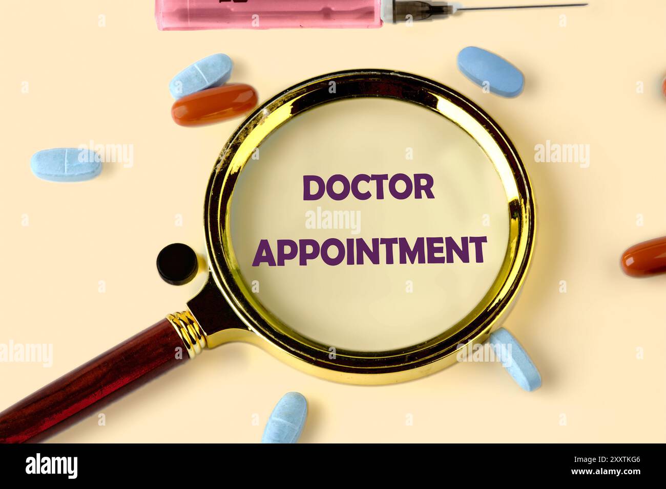 Healthcare concept. Text DOCTOR APPOINTMENT through a magnifying glass ...